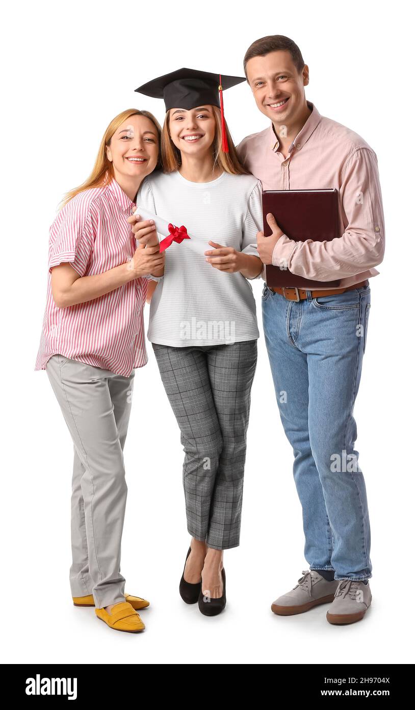 Happy female graduation student with her parents on white background ...