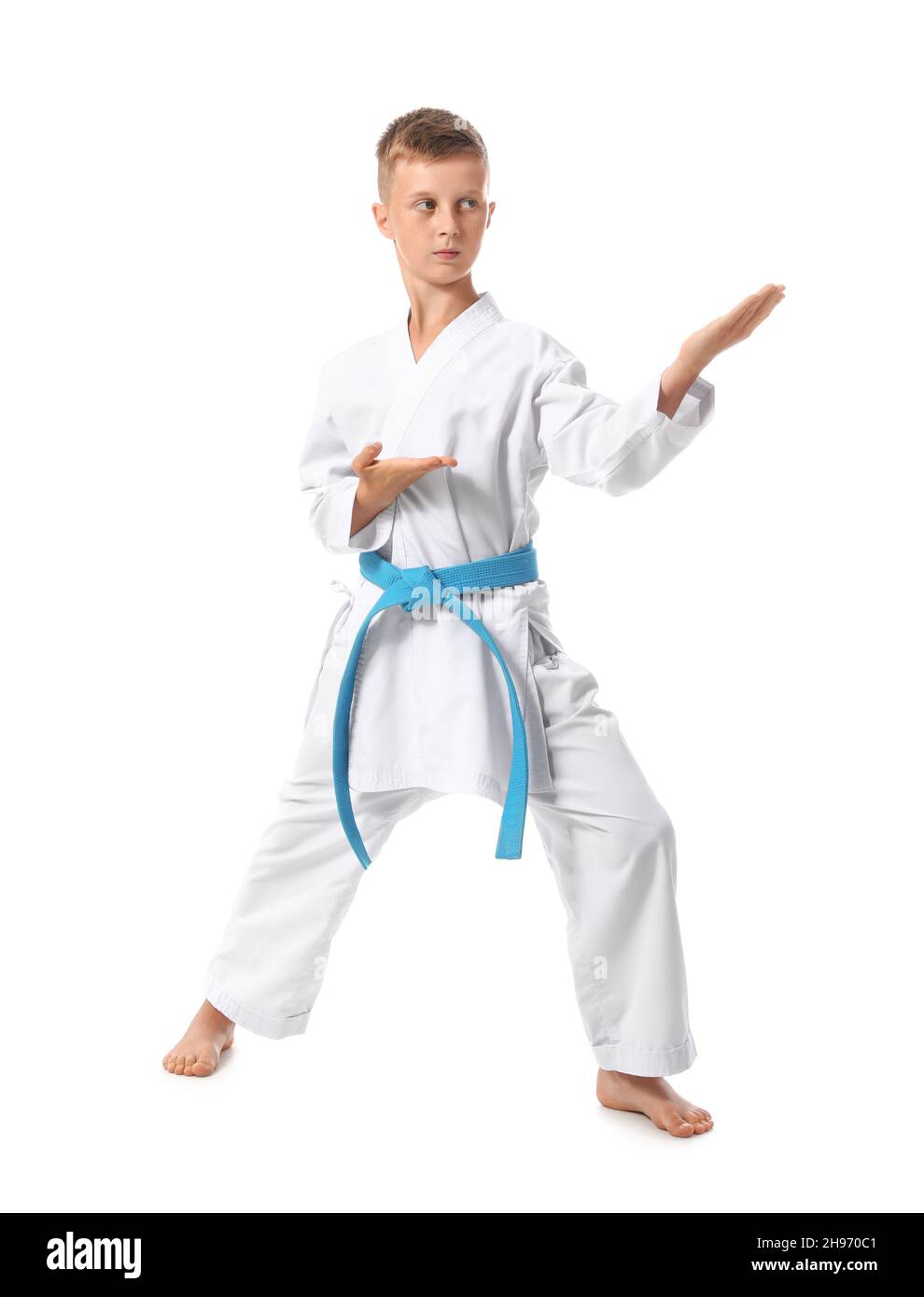 Little boy practicing karate on white background Stock Photo - Alamy