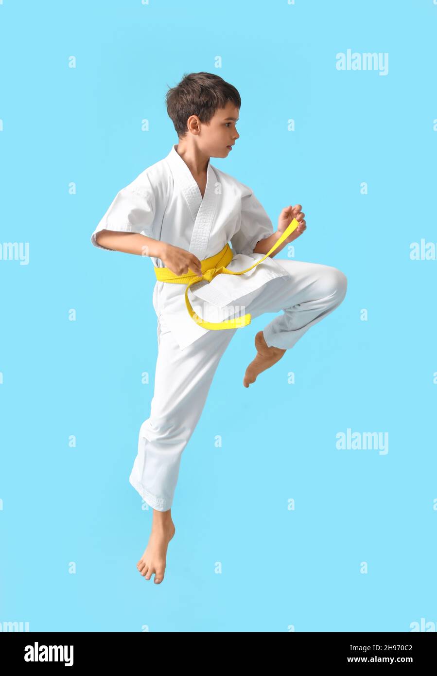 Little boy practicing karate on color background Stock Photo - Alamy