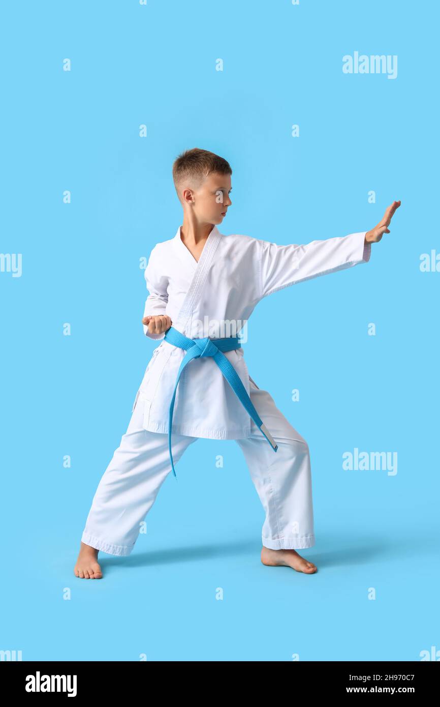 Little boy practicing karate on color background Stock Photo - Alamy