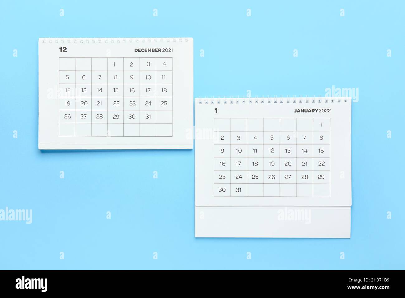 Classic flip paper calendars for December 2021 and January 2022 on ...
