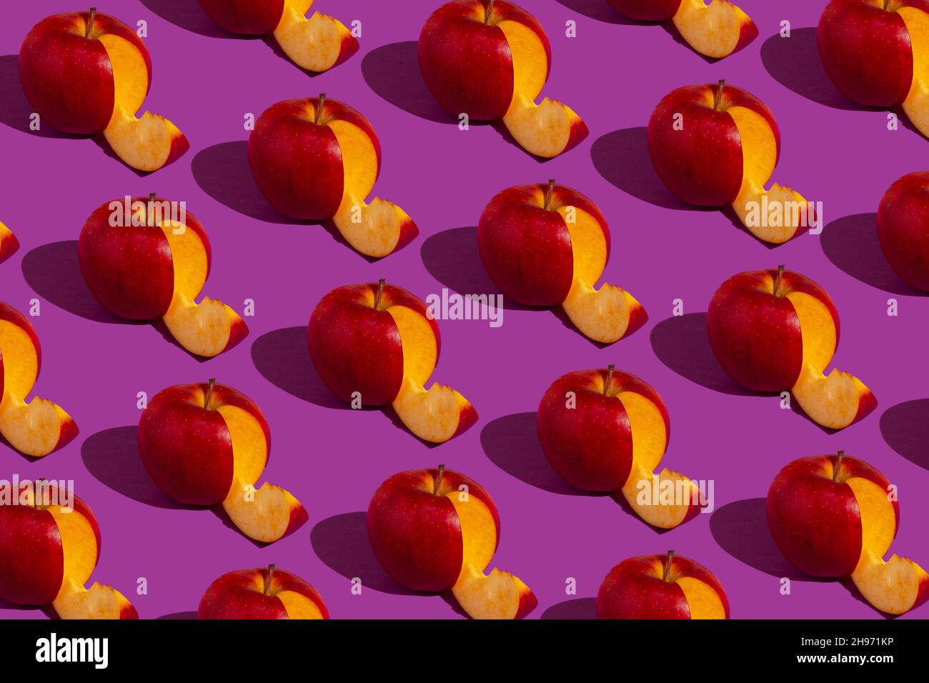 Pattern of sliced apple on a purple background. Minimal creative summer ...