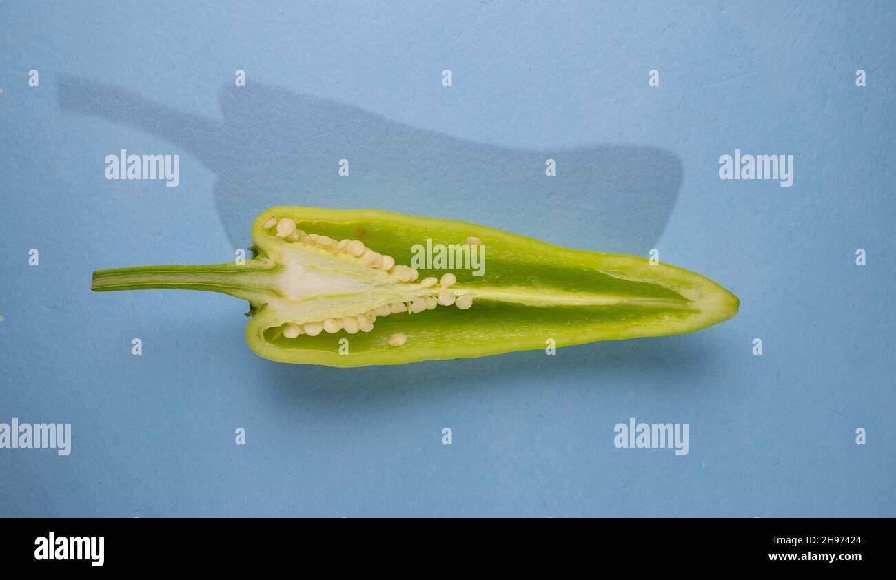 Close up of frsh green chilli peppers on tabel Stock Photo - Alamy