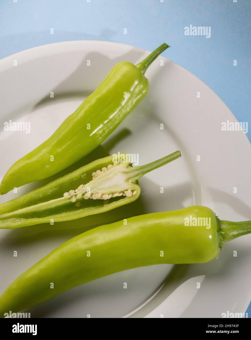 Close up of frsh green chilli peppers on tabel Stock Photo - Alamy
