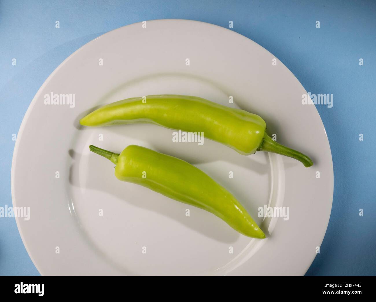 Close up of frsh green chilli peppers on tabel Stock Photo - Alamy