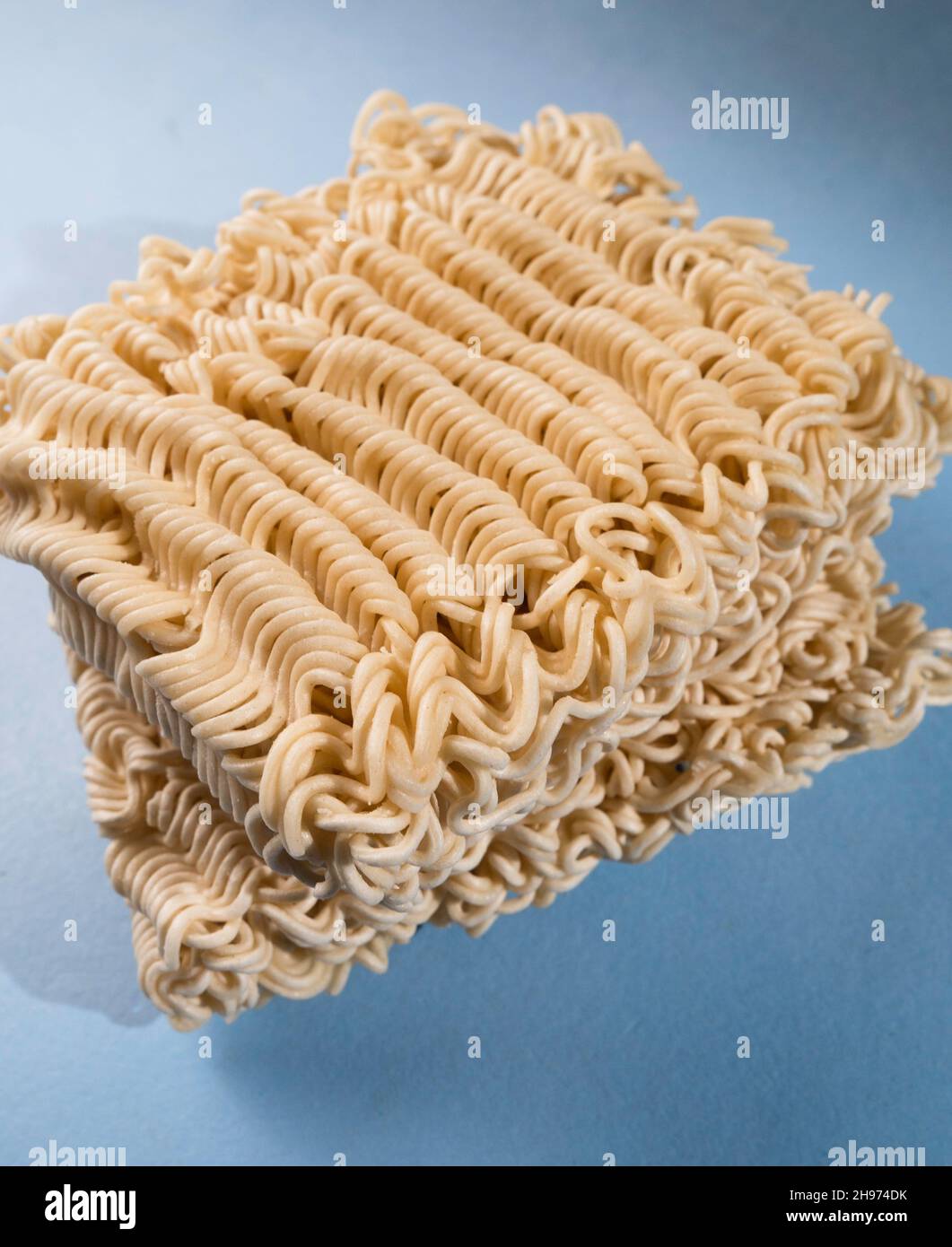 Instant noodles isolated on colour background Stock Photo - Alamy