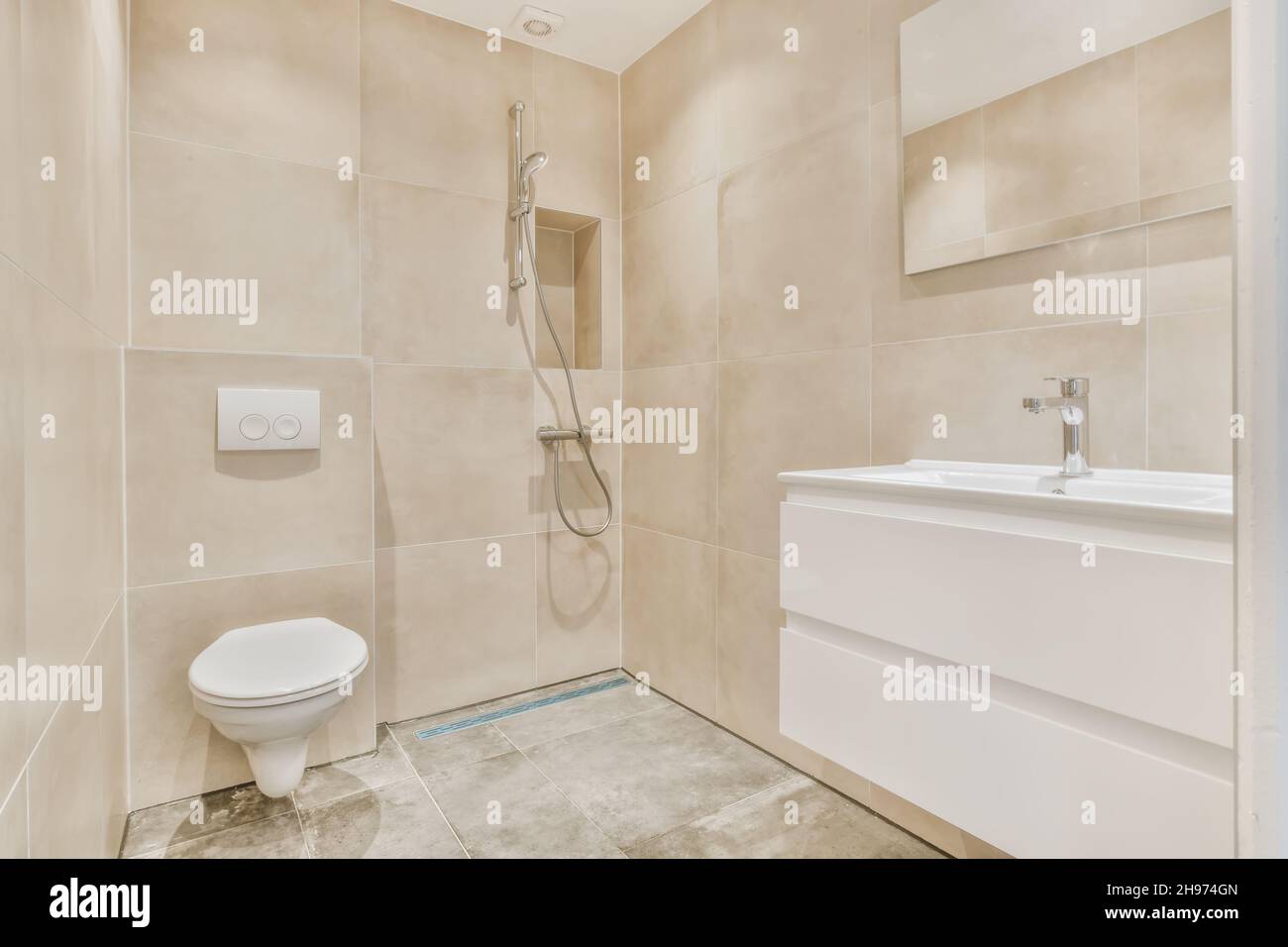 Stylish modern bathroom in beige tones with hanging toilet Stock Photo ...