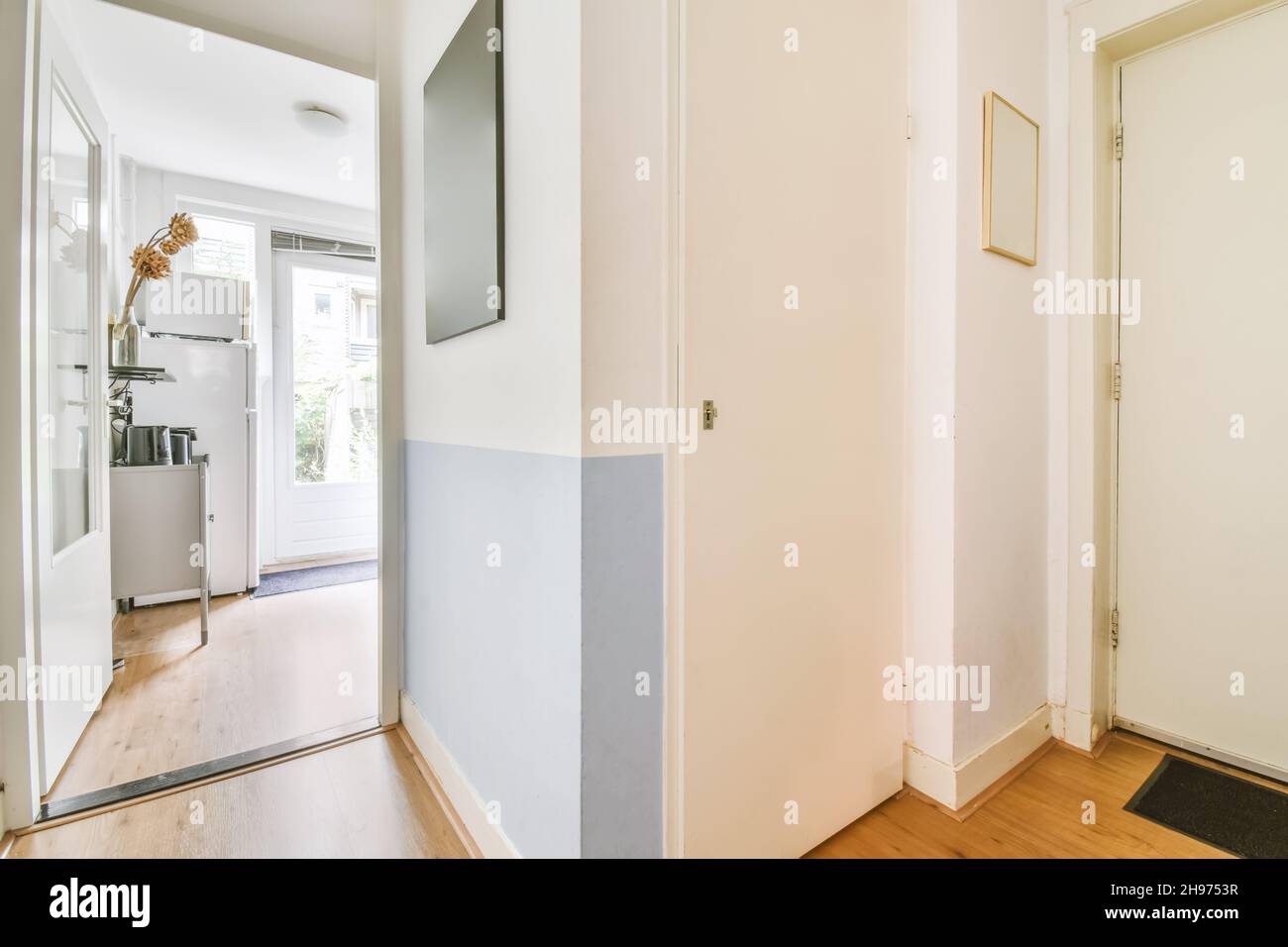 Delicate corner corridor with paintings hanging on the wall Stock Photo ...
