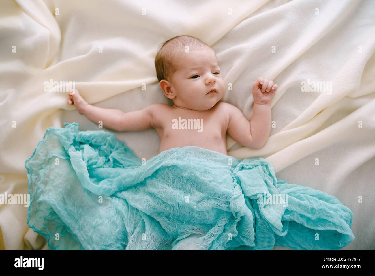 Newborn baby lies on bed hi-res stock photography and images - Alamy