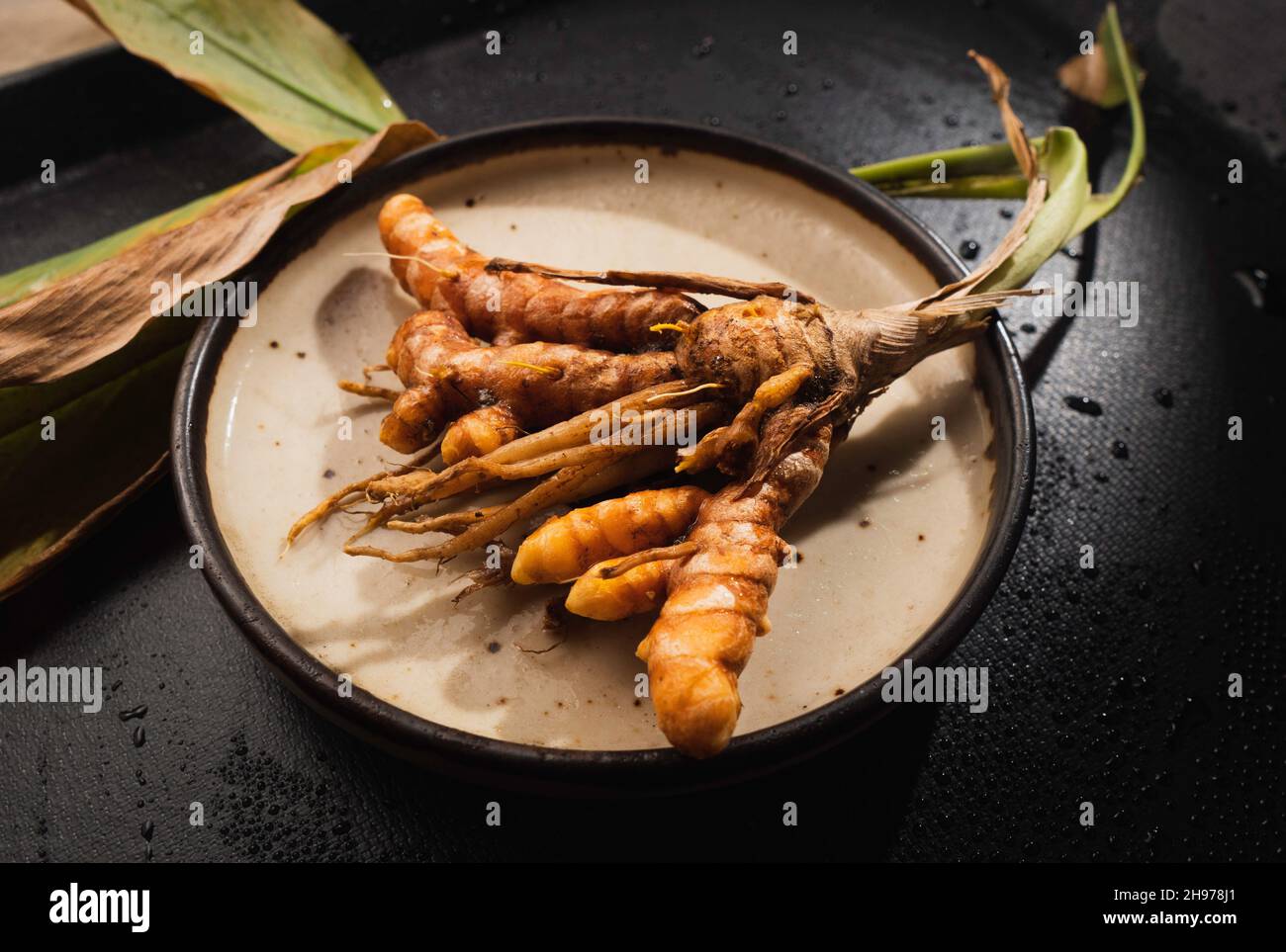 Close up of fresh healthy turmeric in slices Stock Photo - Alamy