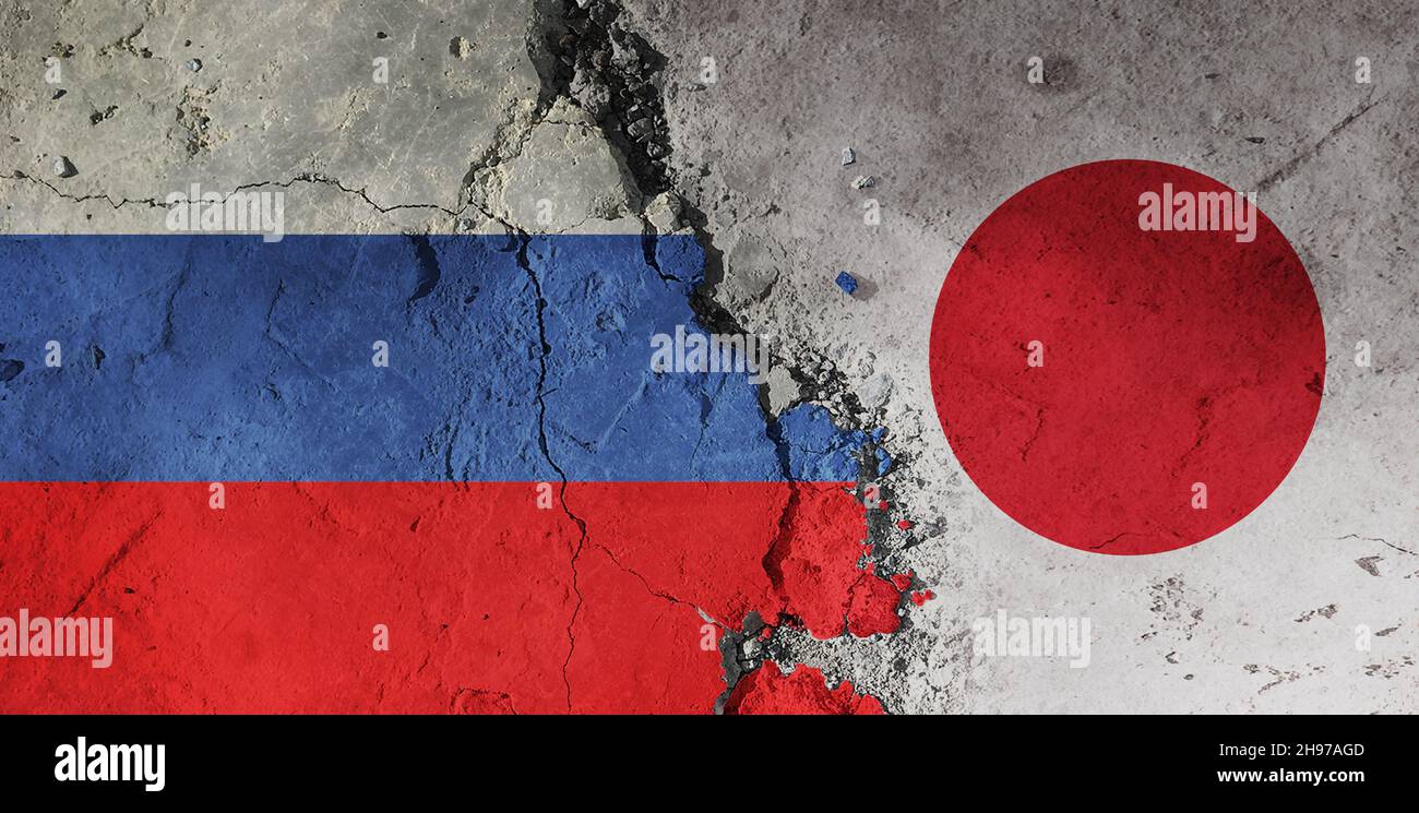 russia vs japan flag on a rough background. Broken and cracked ...