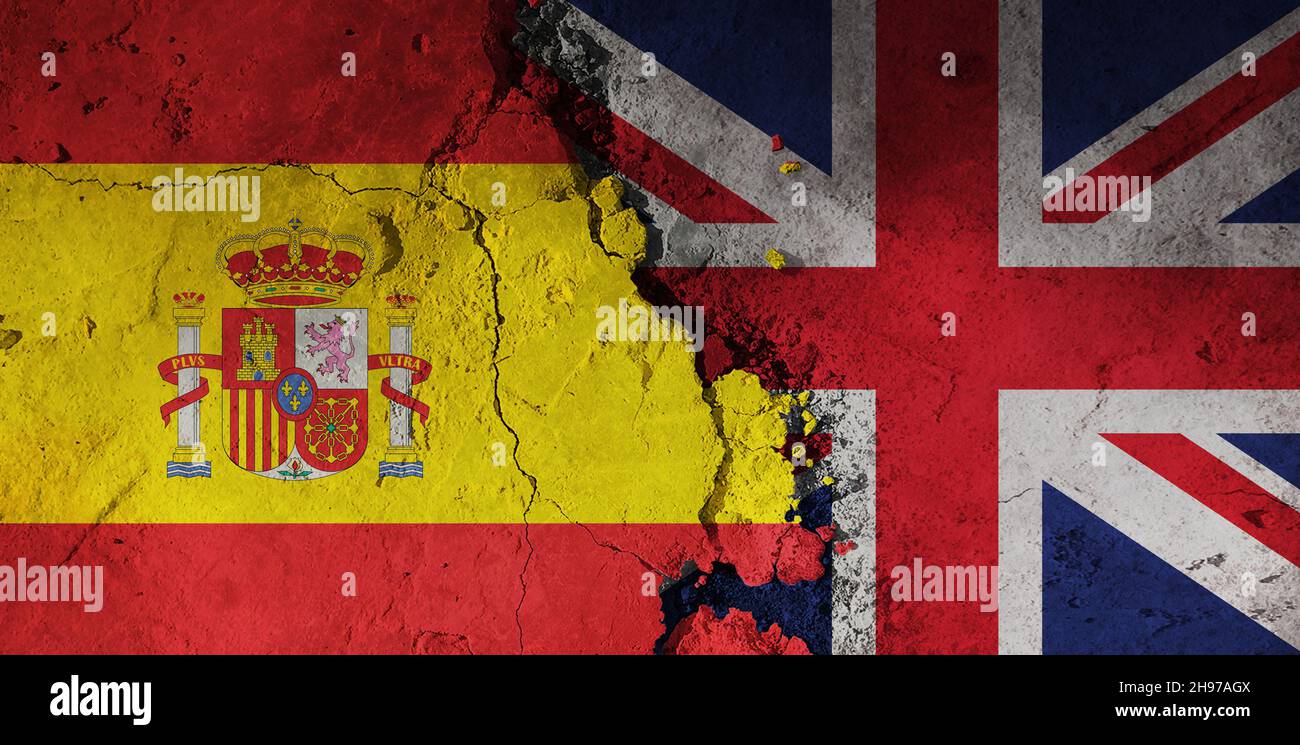 Spain vs UK flag on a rough background. Broken and cracked background ...