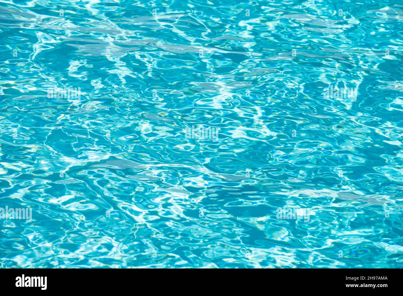 Abstract ripple wave and clear turquoise water surface in swimming pool ...