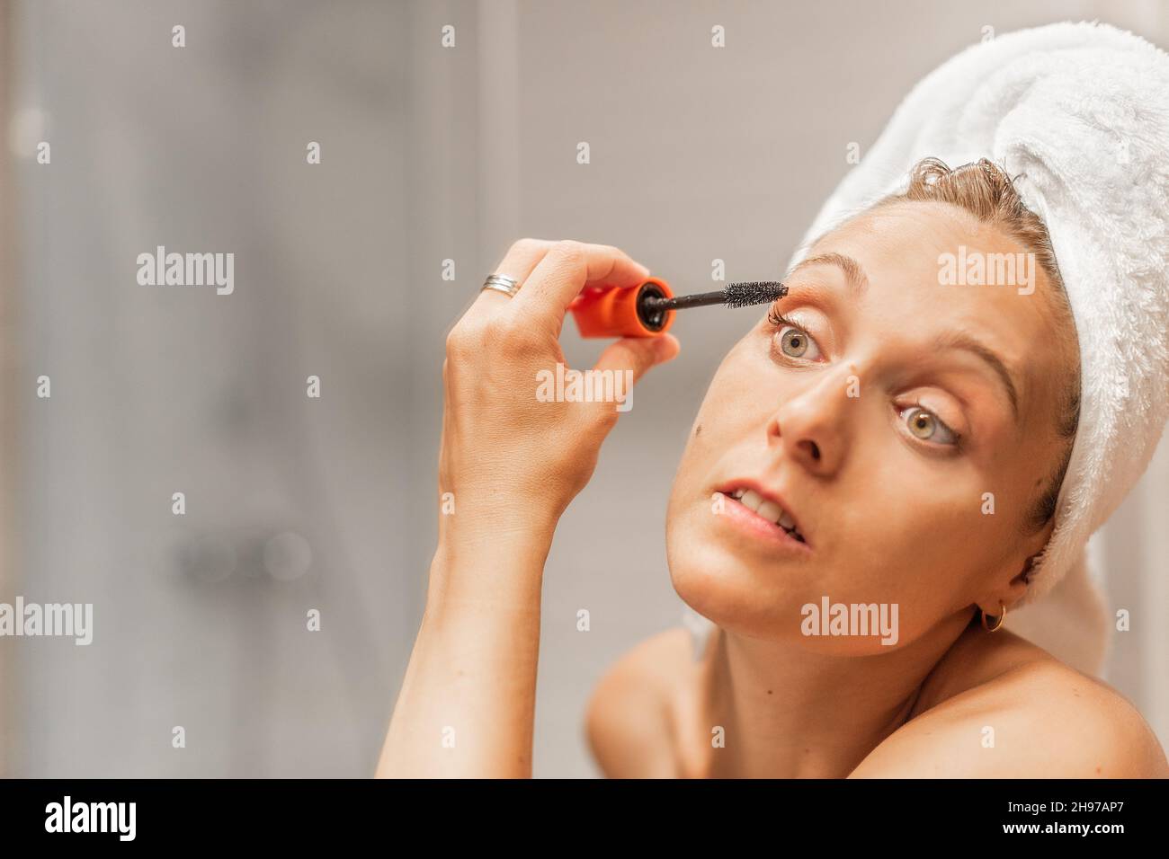 Mascara woman white make up apply hi-res stock photography and images ...