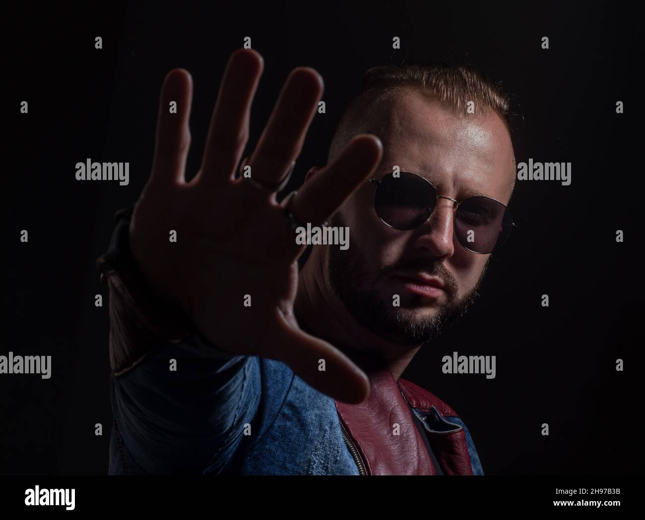 Guy covered face with hands and doing stop gesture with sad and fear ...