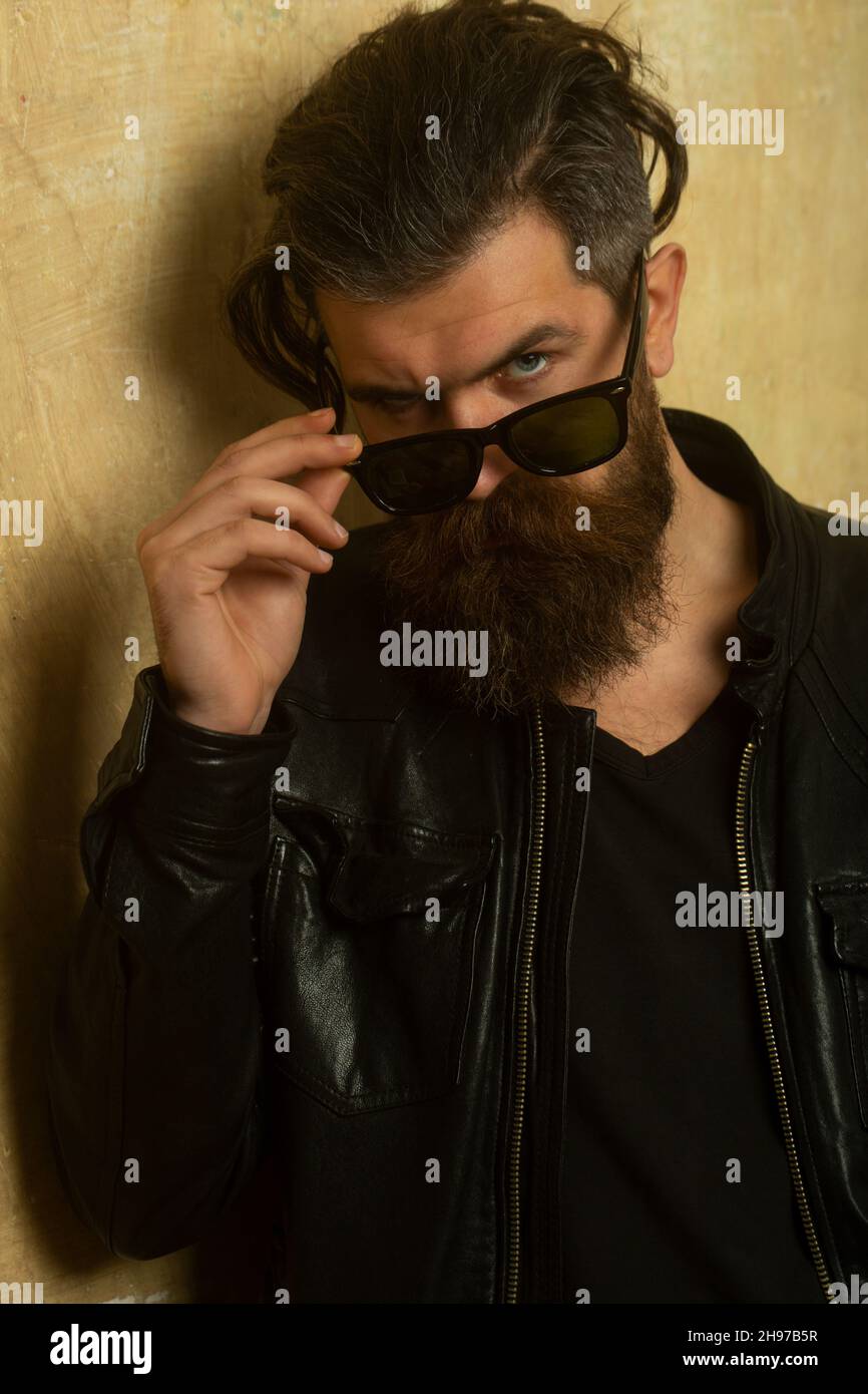 Brutal angry gang man lifestyle, serious handsome guy. Bearded hipster ...