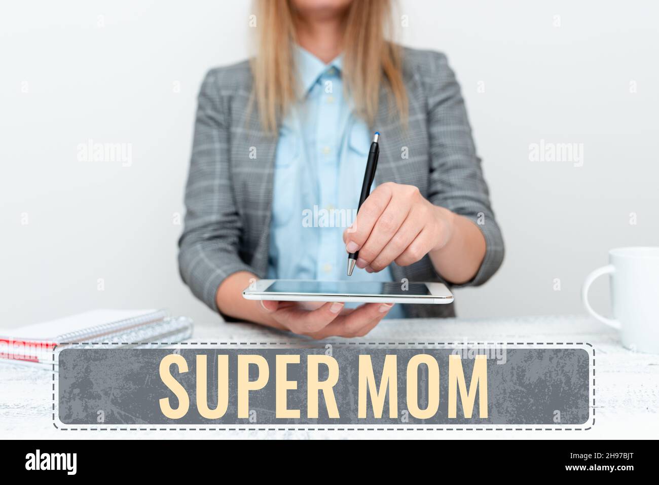 Conceptual display Super Mom. Conceptual photo a mother who can combine ...