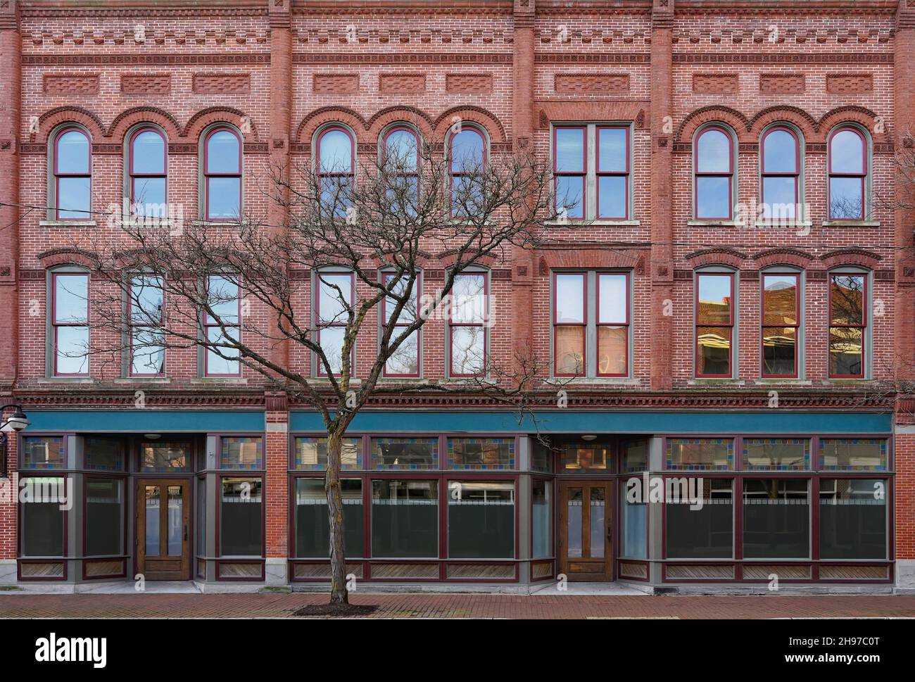Facade of old fashioned 19th century main street brick commercial ...