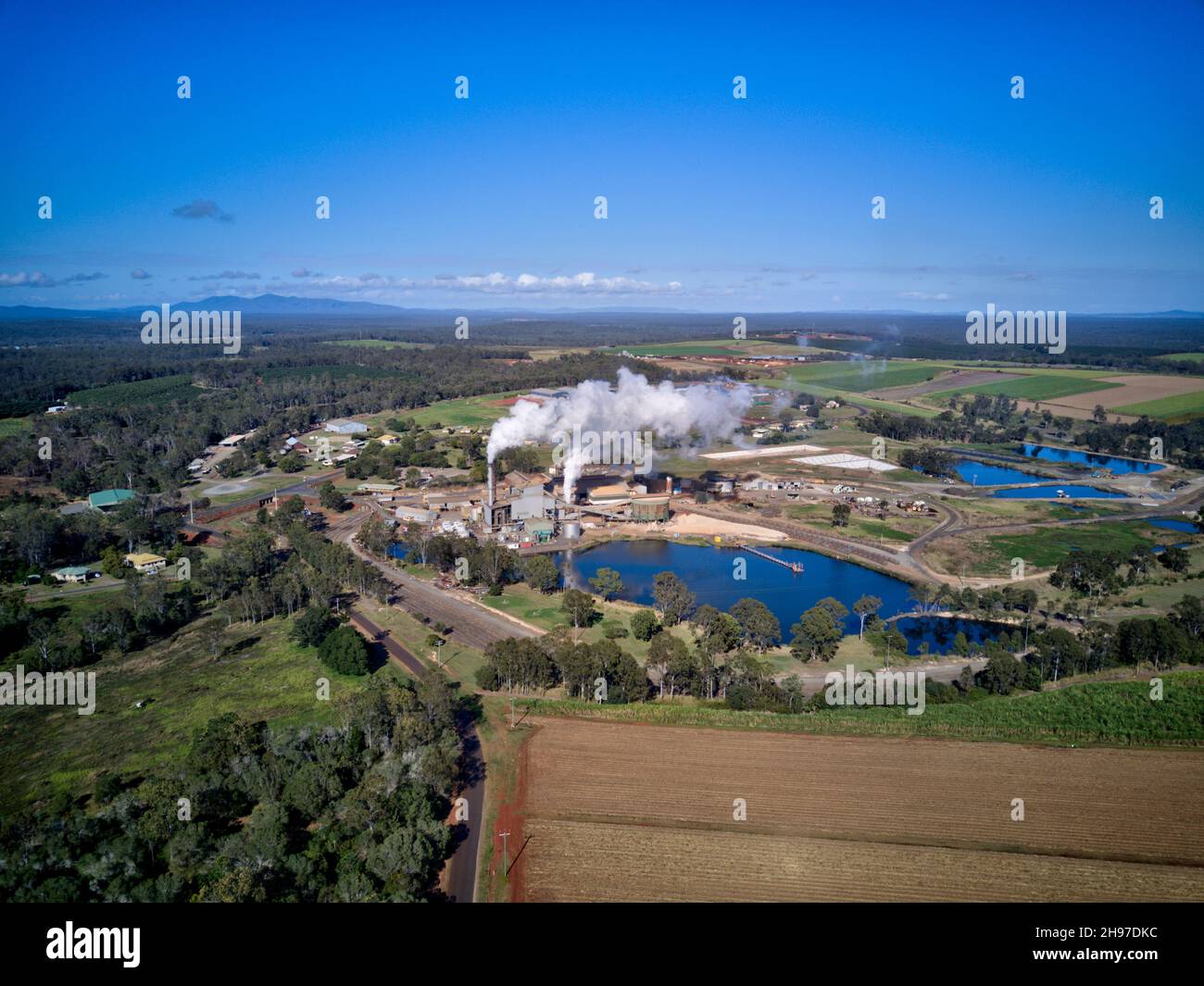 Aerial of factory processing the local sugar cane crop at the Isis ...
