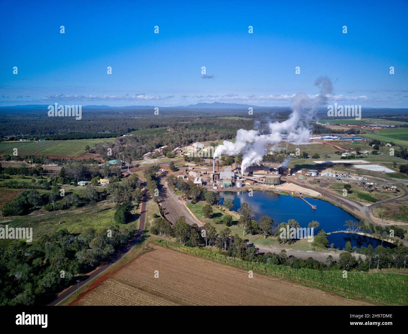 Aerial of factory processing the local sugar cane crop at the Isis ...