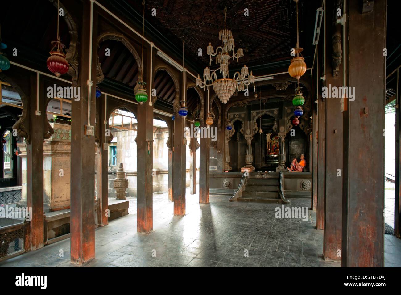 Temple hall with Wooden pillars and Chandelier Stock Photo - Alamy
