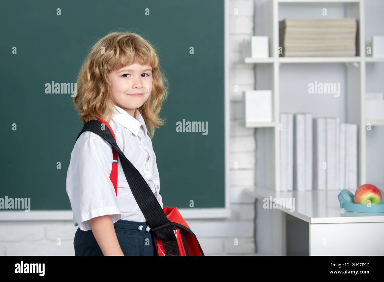Portrait of funny pupil boy of primary school study. Funny kid at ...