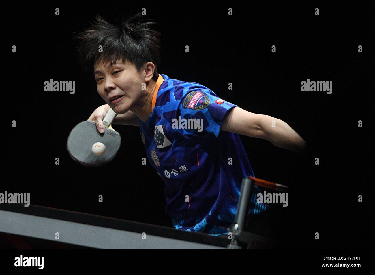 Singapore. 5th Dec, 2021. Cheng I-Ching of Chinese Taipei hits a return ...