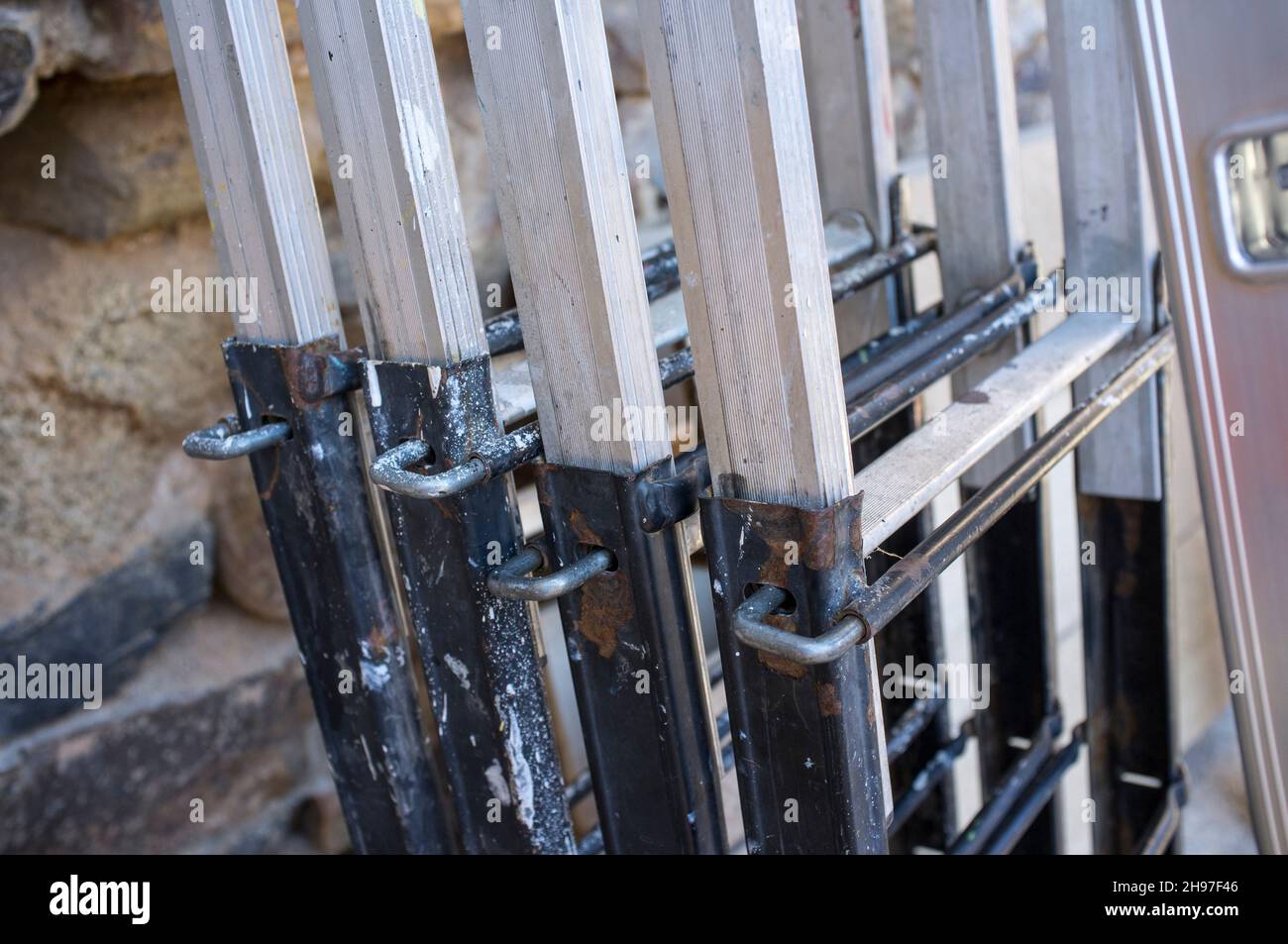 Professionals ladders folded stand over old town building. Twin step ...
