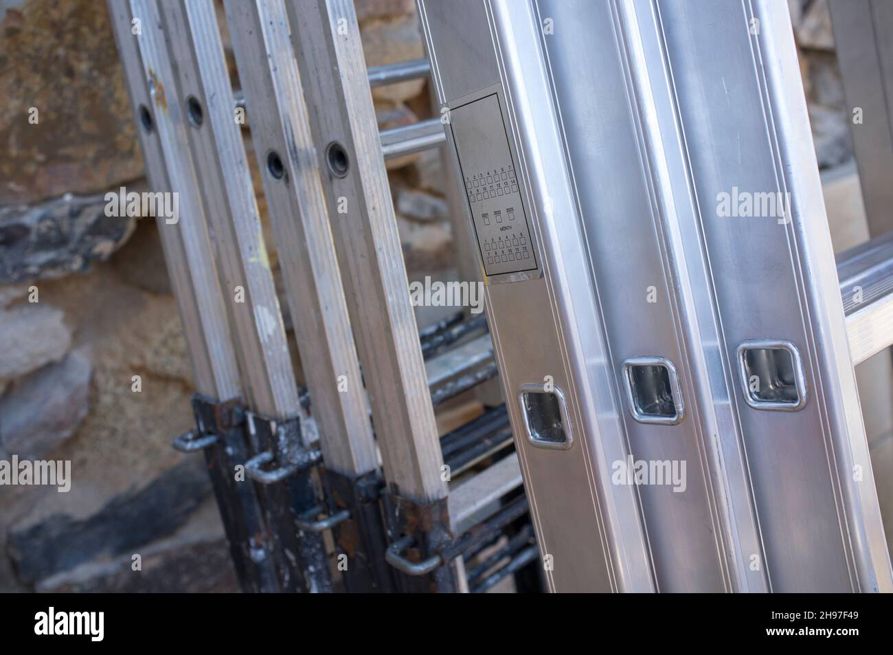 Professionals ladders folded stand over old town building. Extension ...