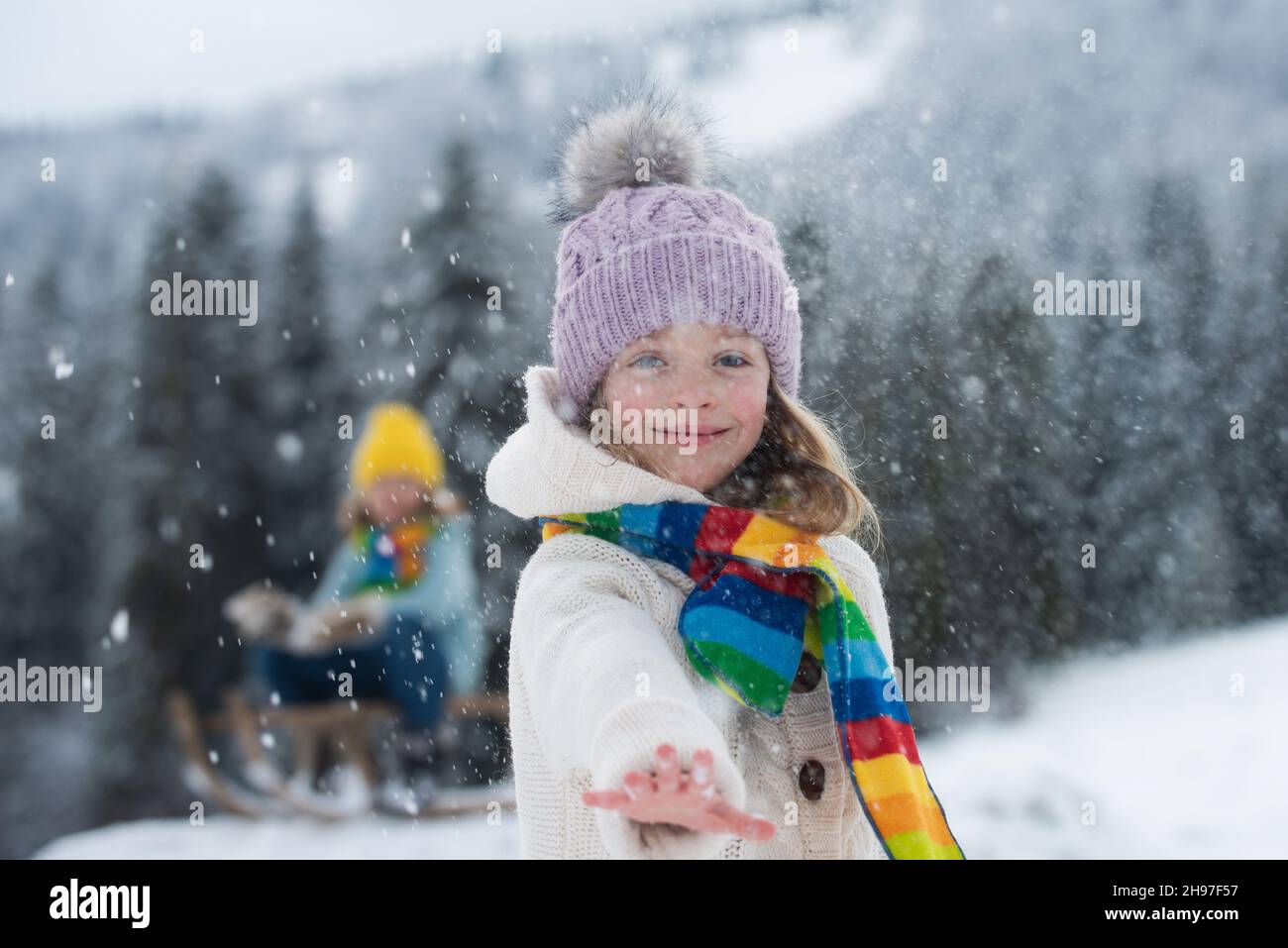 Funny excited child girl face in snow on winter outdoor. Children in ...