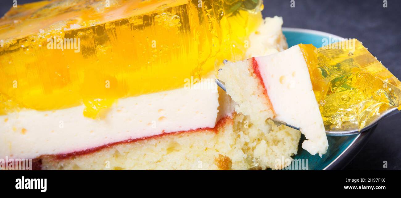 Creamy sweet sponge cake with layers and jelly. Delicious festive ...