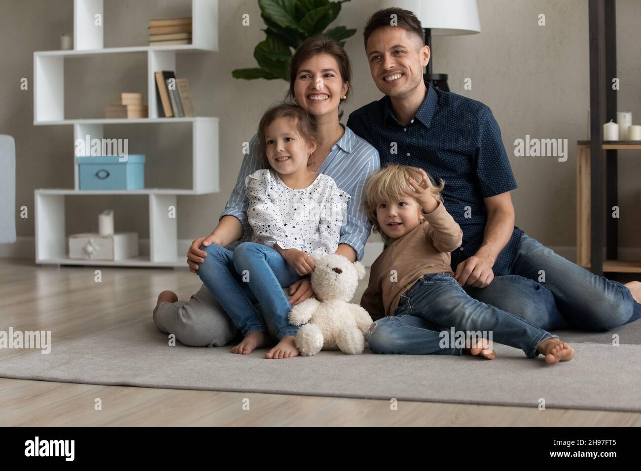 Happy sweet family posing on photo shooting at home Stock Photo - Alamy