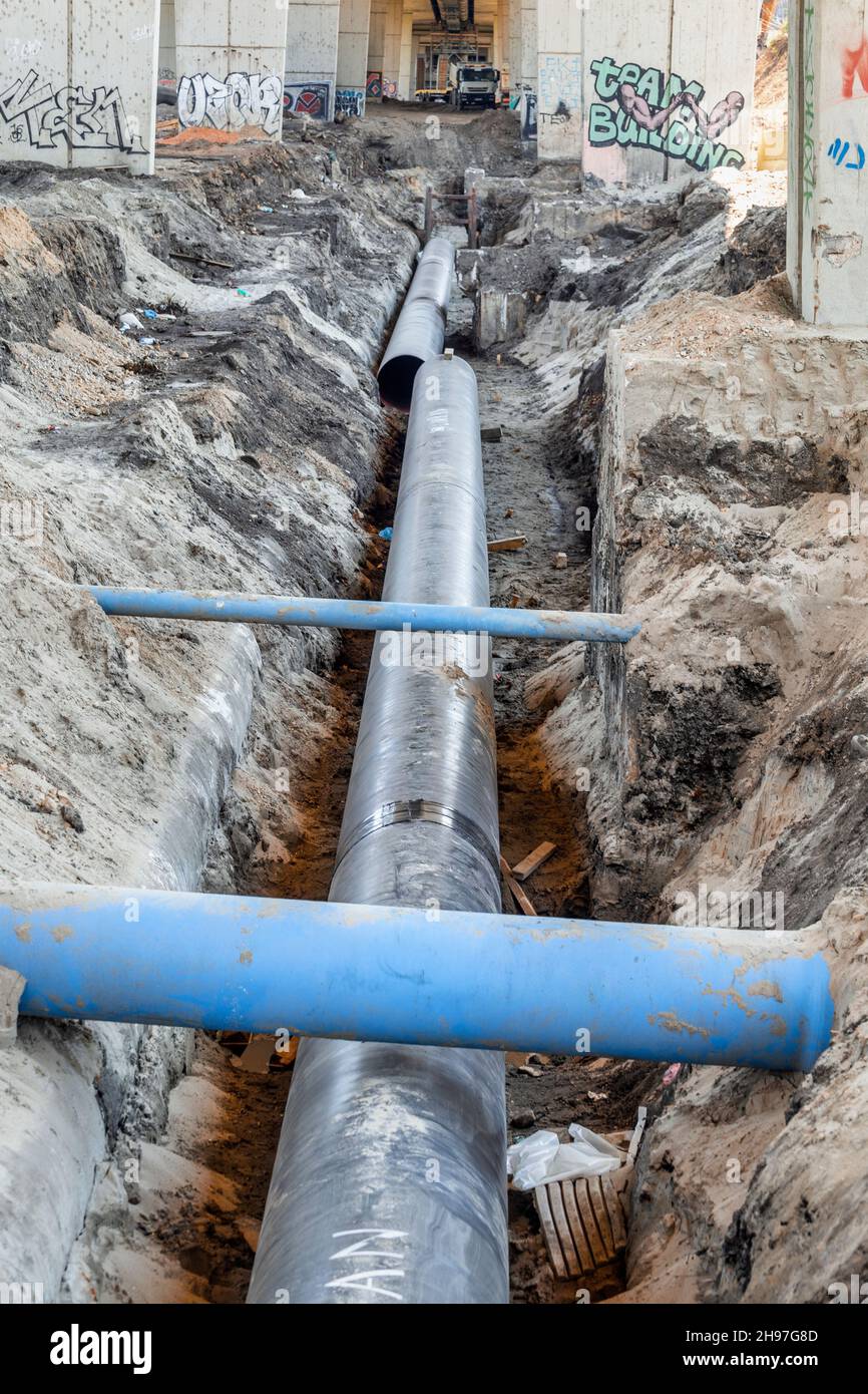 District heating pipes under bridge. Reconstruction of heating systems ...