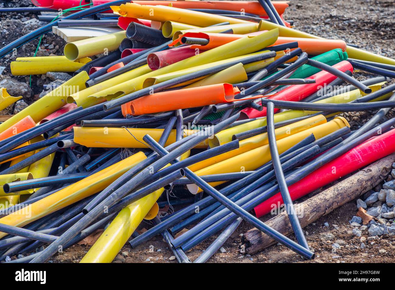 Heap of waste of different pvc pipes background at construction site ...