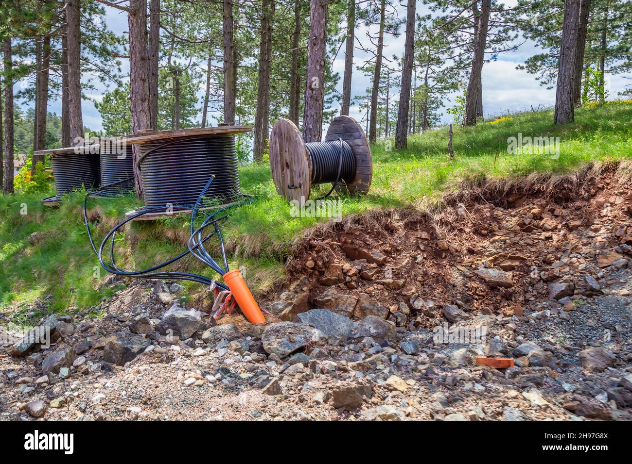 High voltage electrical cable and water pipes is laid in a trench full ...