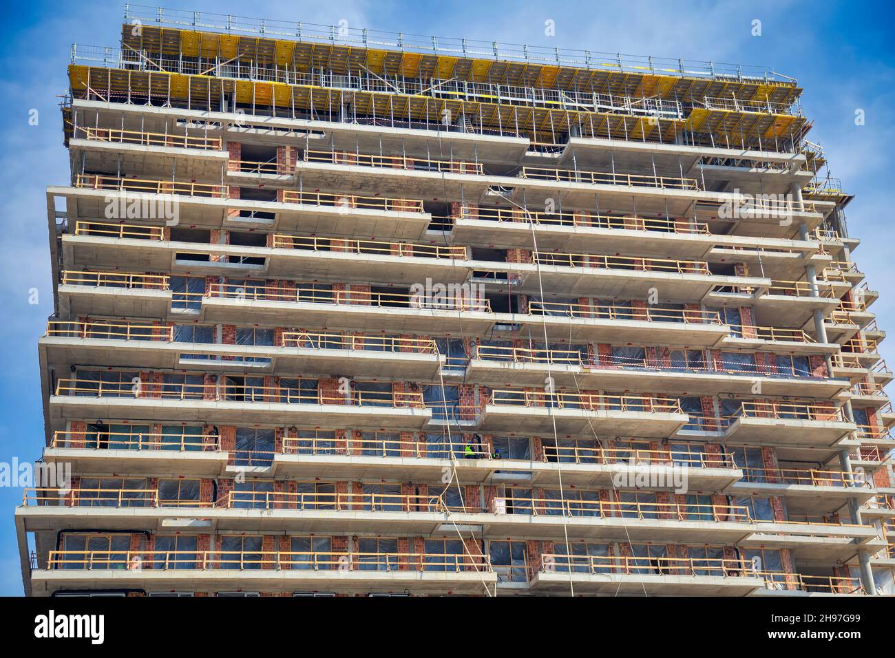 Incomplete building construction with scaffolding detail on ...