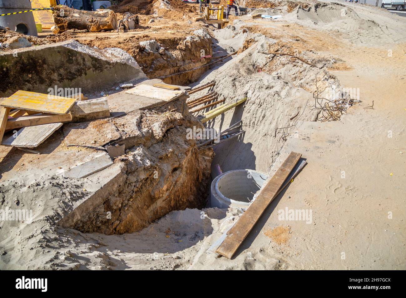 Reconstruction work on the city street, backfill and power cables ...