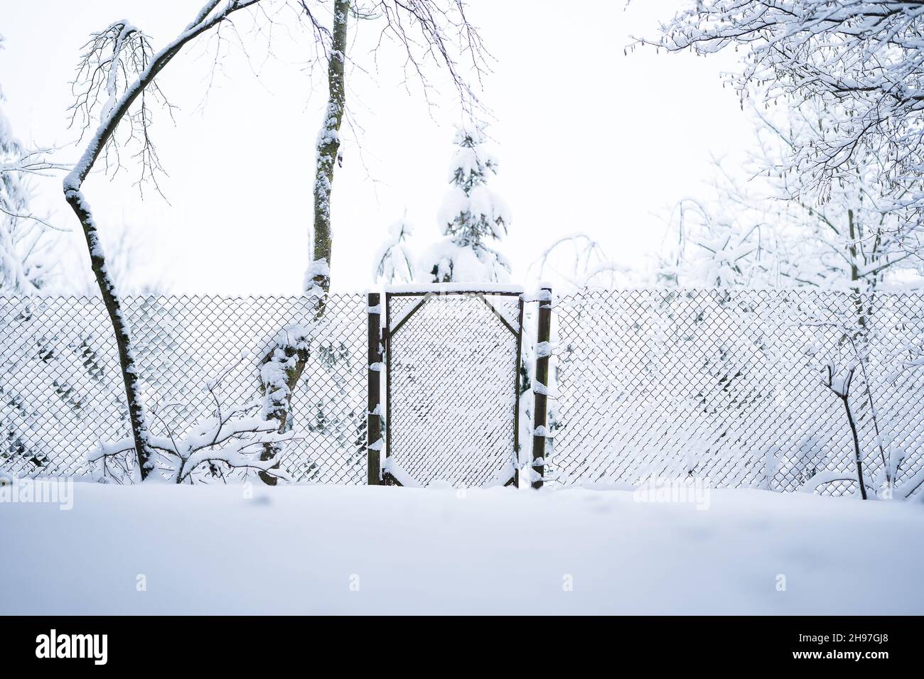 The Gates in the garden with snow in winter time Stock Photo - Alamy