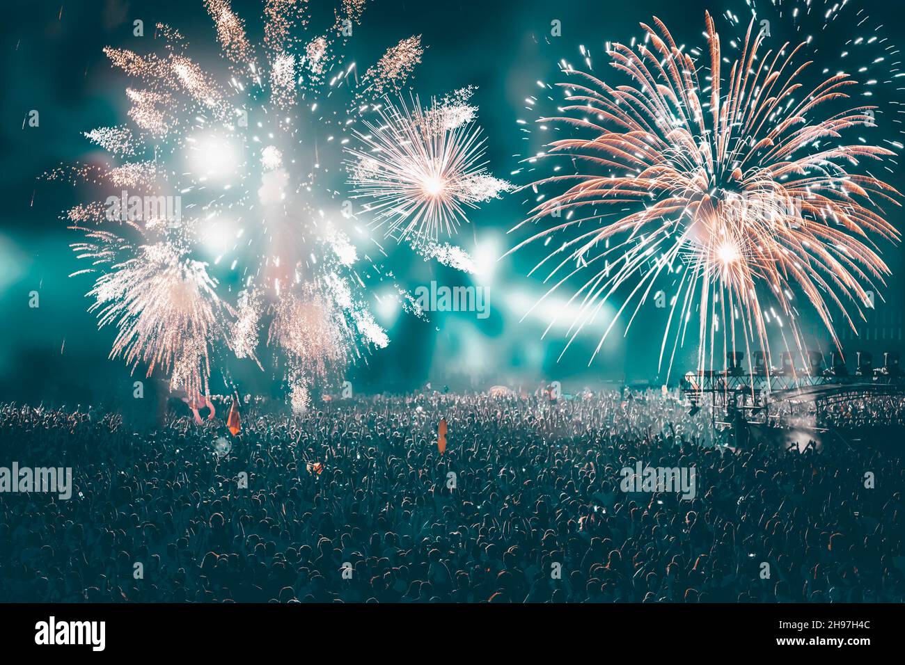 Colorful fireworks and crowd celebrating the New Year Stock Photo - Alamy