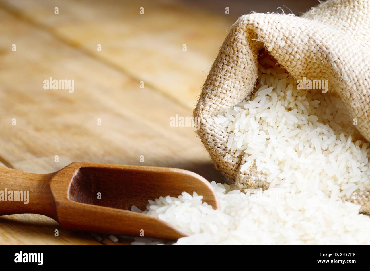 Organic rice grains in burlap sack with copy-space Stock Photo - Alamy