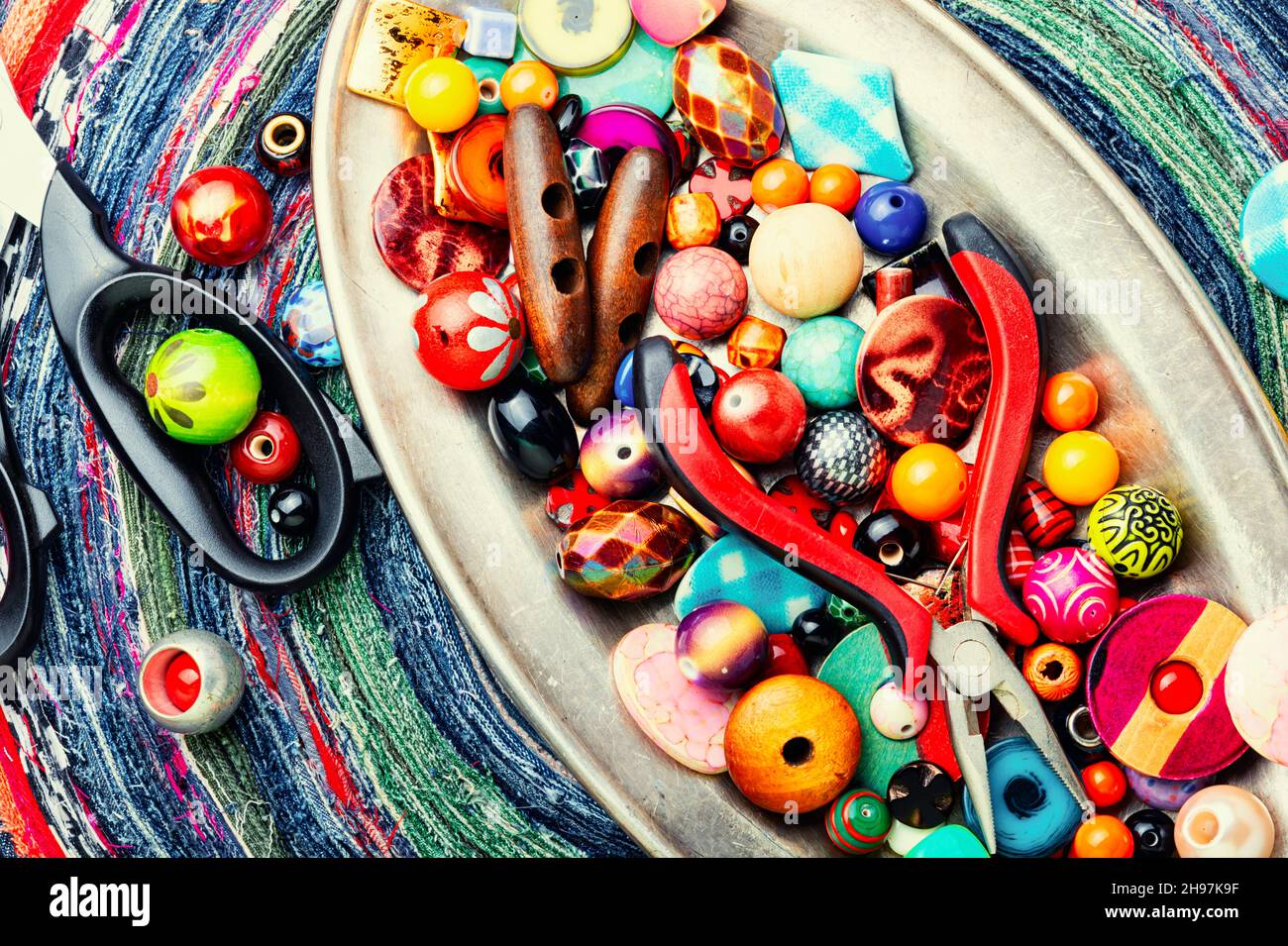 A set of bright beads of different types for needlework. Beads on a ...