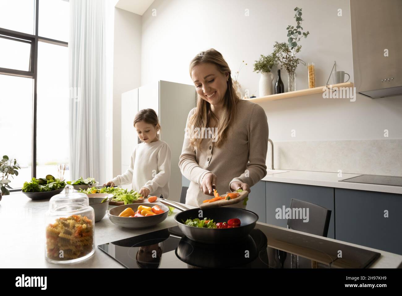 Happy two female generations family cooking in kitchen Stock Photo - Alamy