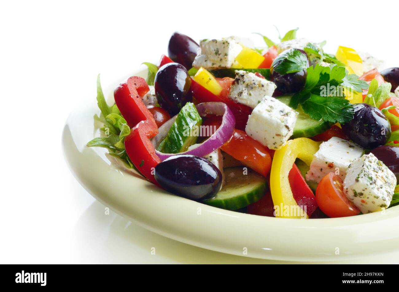 Homemade greek salad on white background Stock Photo - Alamy