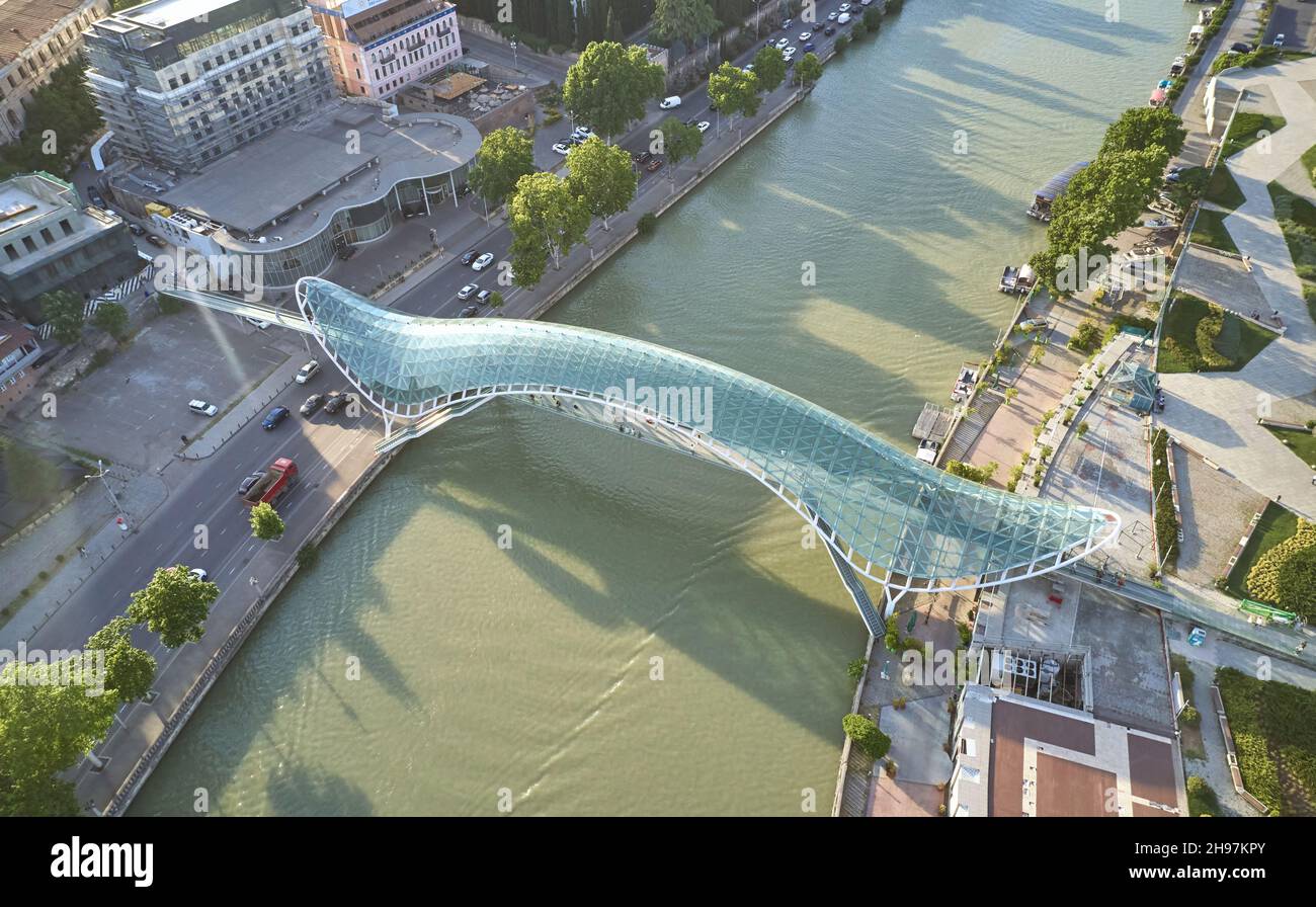 Freedom bridge over Kura river in Tbilisi city aerial view Stock Photo ...