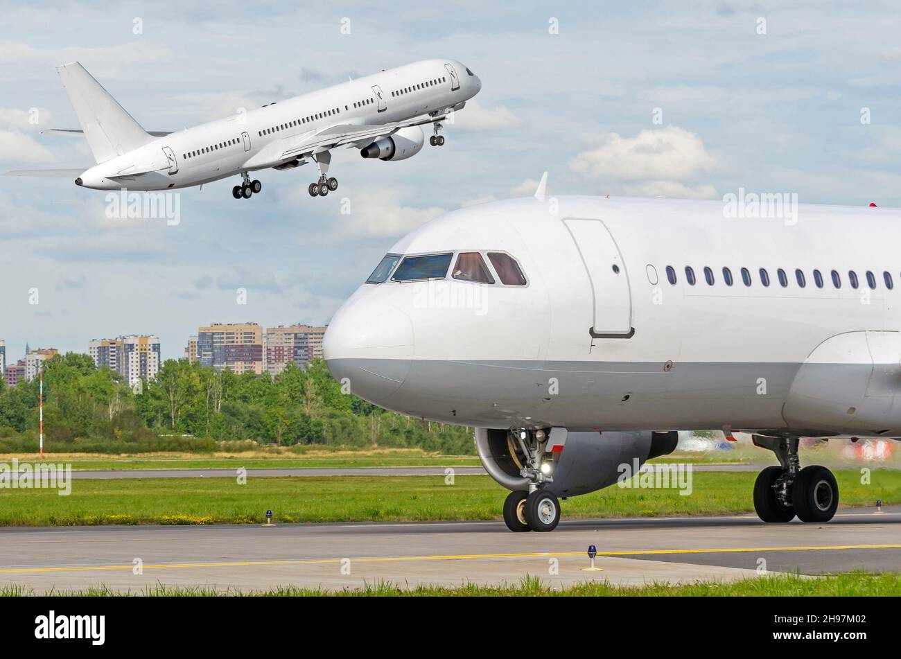 Flying take off plane and another airplane taxiing close-up cockpit cab ...