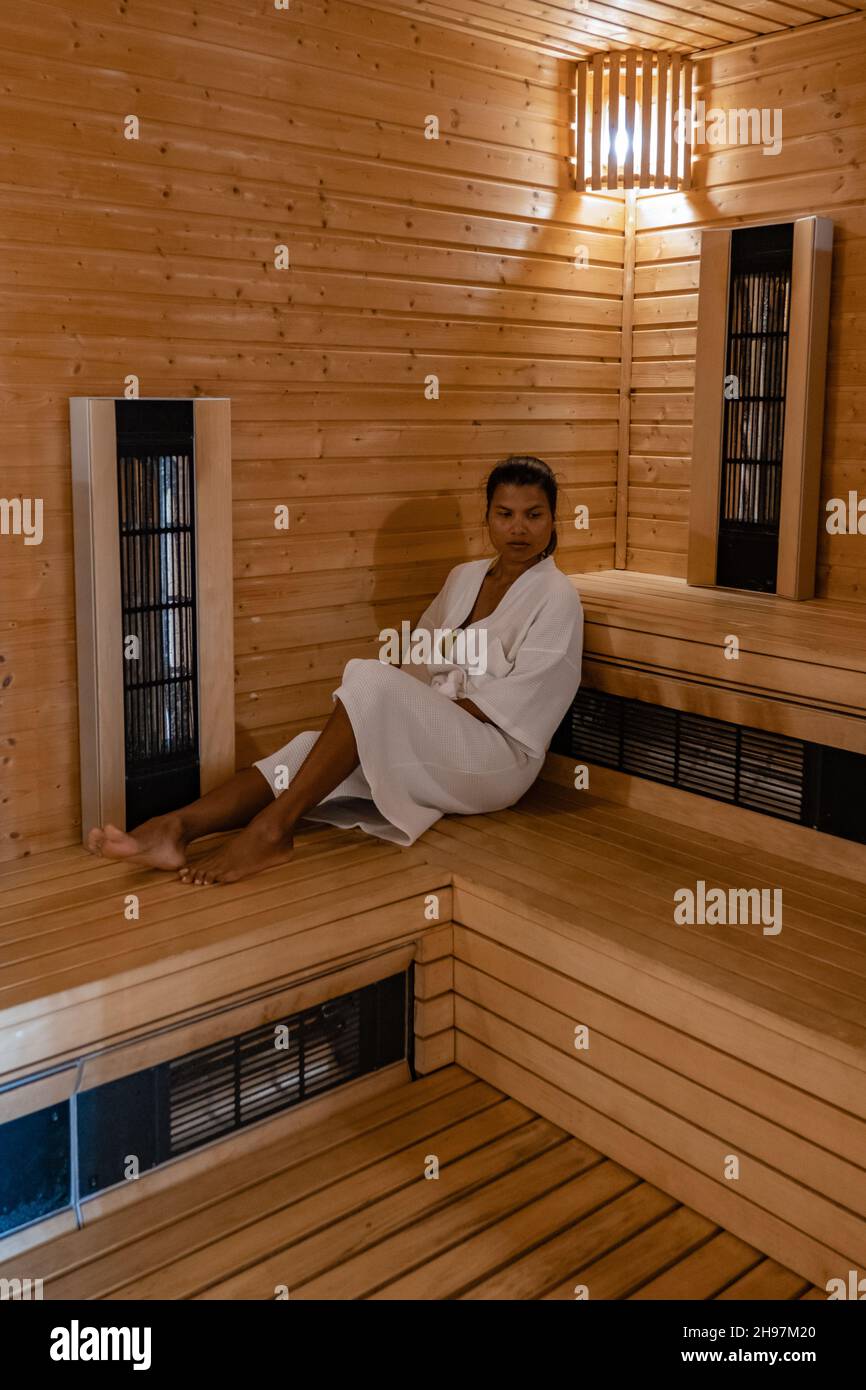 Sauna, Asian woman mid age in Spa Infrared Sauna in a Wellness Stock ...