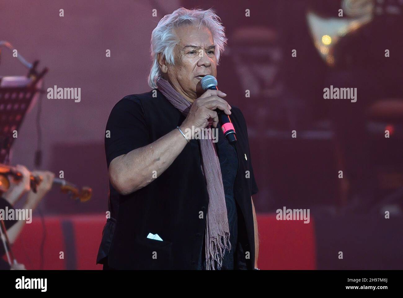 The singer Victor Heredia, performs for the public during the concert ...