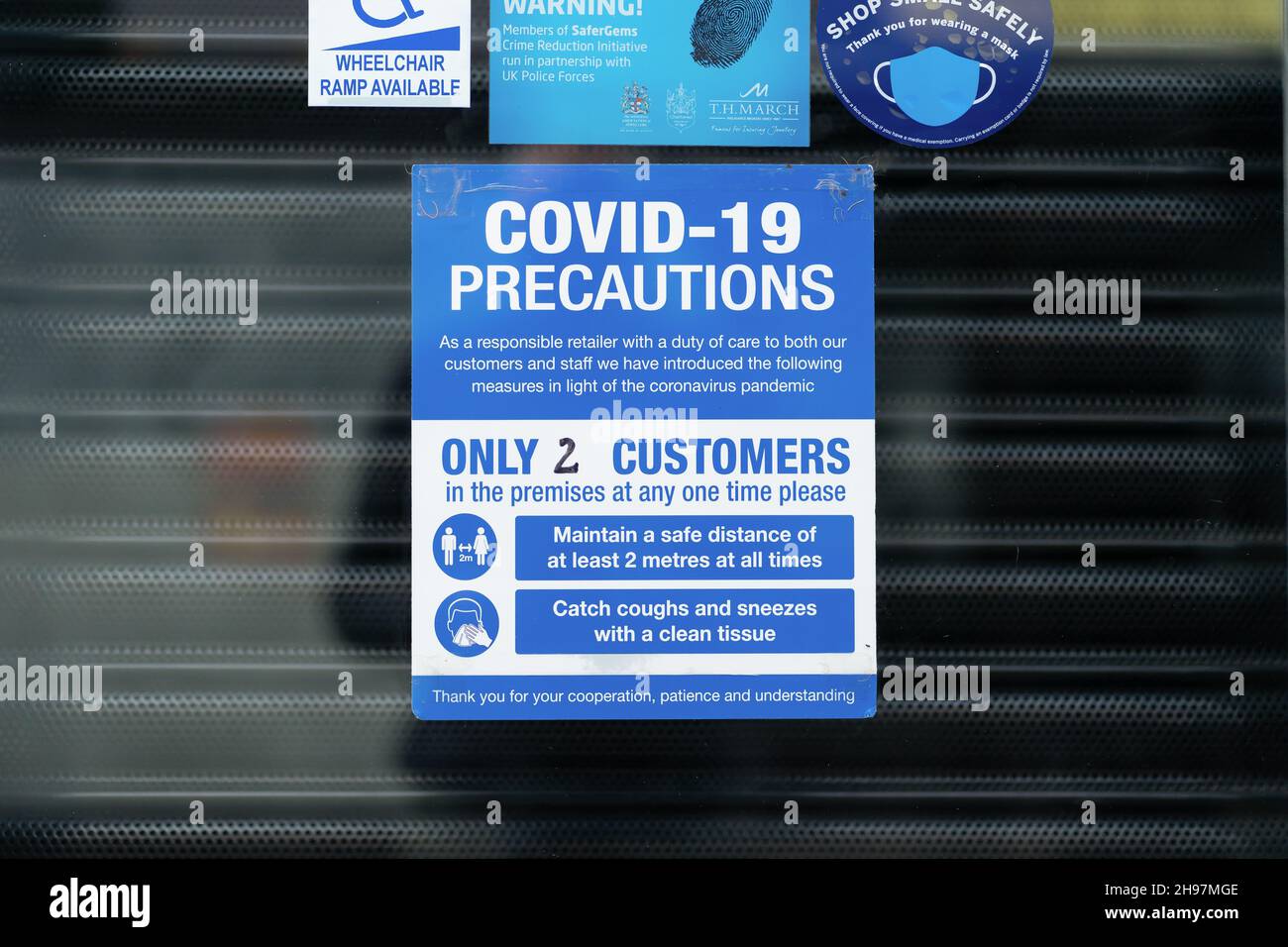 Covid 19 Precautions sign Stock Photo - Alamy