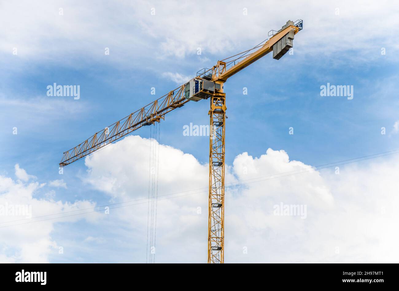 Construction crane and blue sky Stock Photo - Alamy