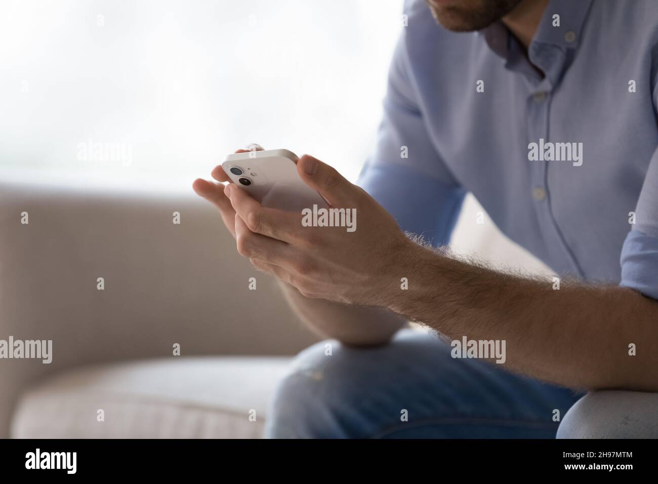 Close up hands of user using app on mobile phone Stock Photo - Alamy